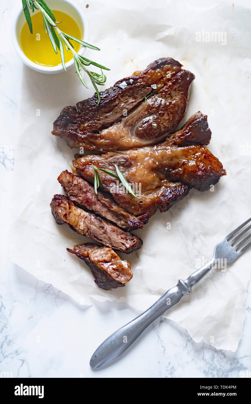 Cooked black angus prime beef steak with rosemary and olive oil on ...