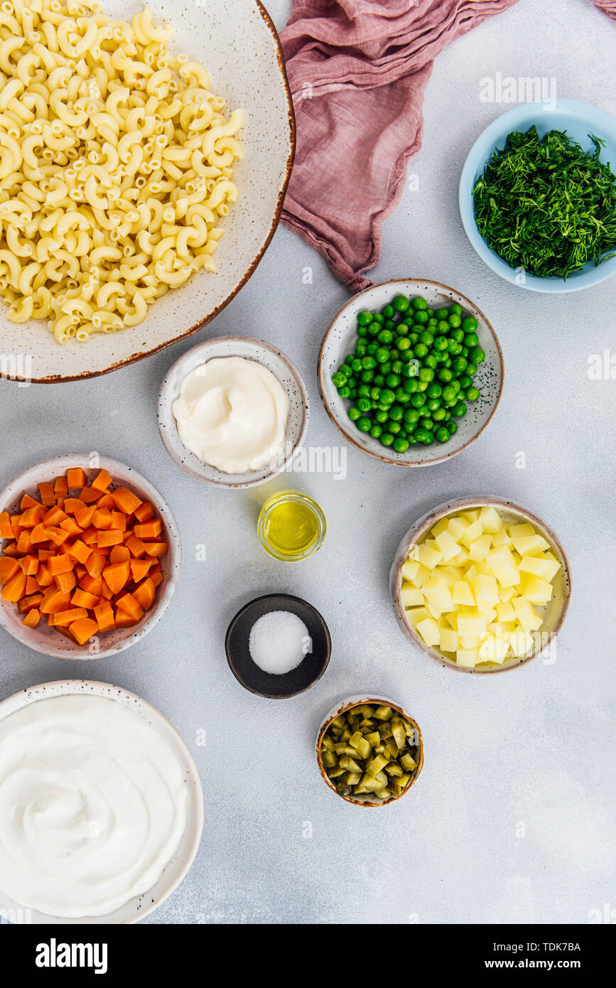 Macaroni salad ingredients photographed on a grey background Stock ...
