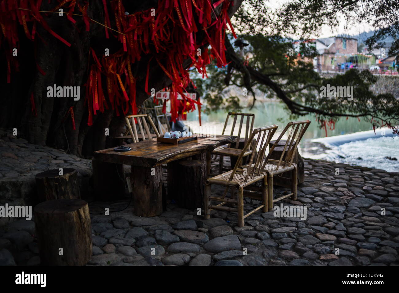 The tea table under the big tree Stock Photo - Alamy