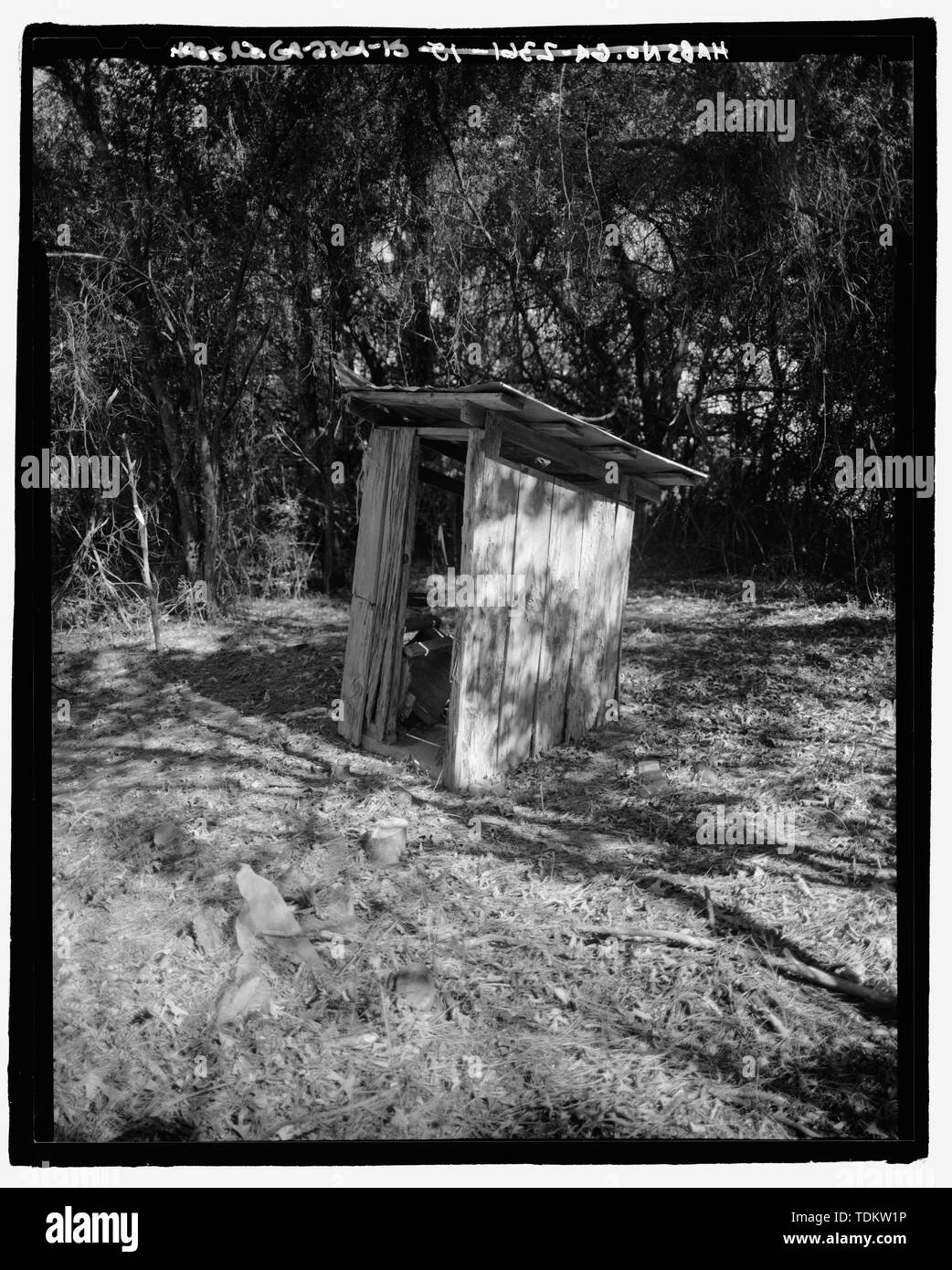 Oblique of front and west elevation of privy, facing southeast. - Free ...