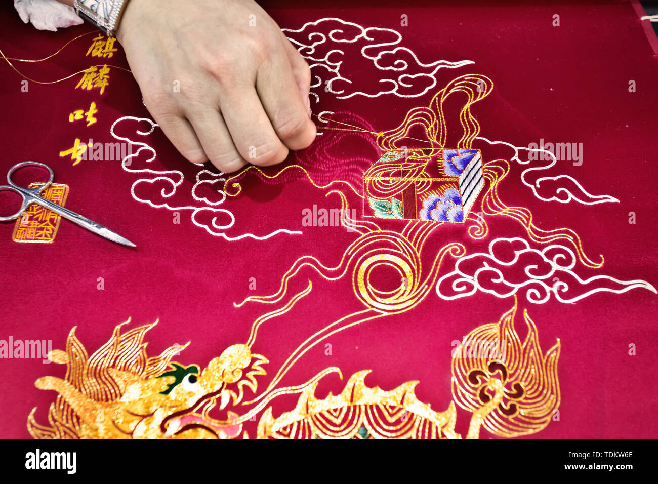 Woman embroidering hi-res stock photography and images - Alamy