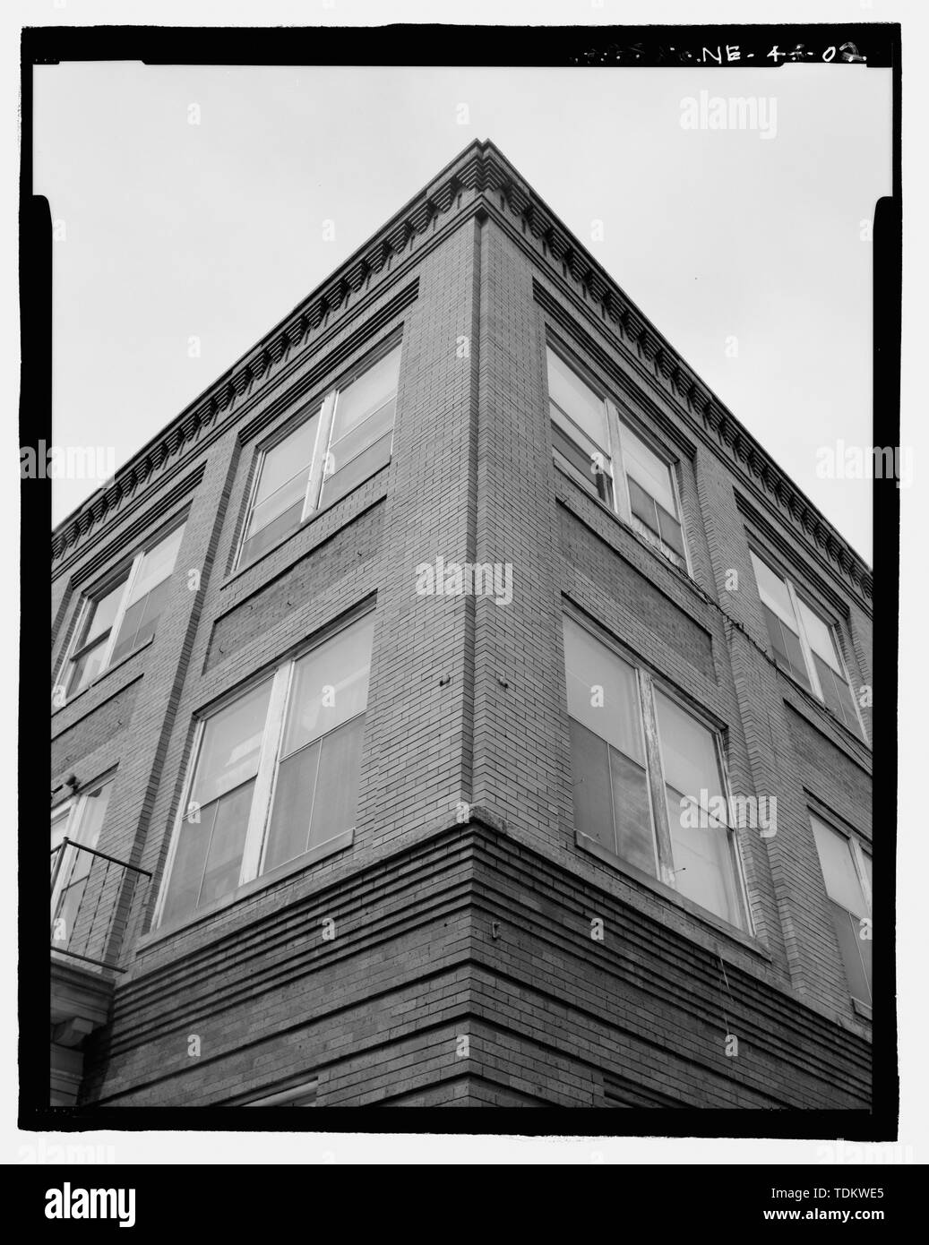 Oblique view looking up at the southwest corner of the building showing ...