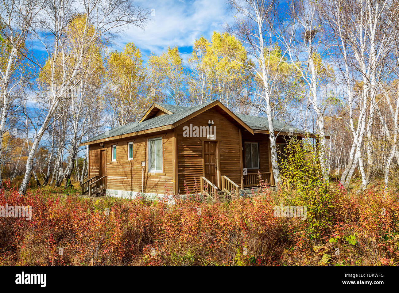 Paddock dam on sun lake lake wooden house autumn color Stock Photo - Alamy