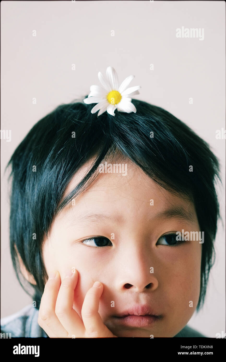 Child with flower on nose Stock Photo - Alamy