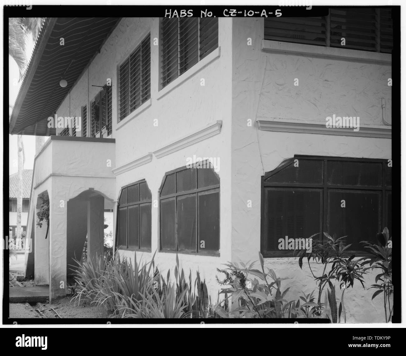 Oblique view of northwest corner showing screened openings at ground ...