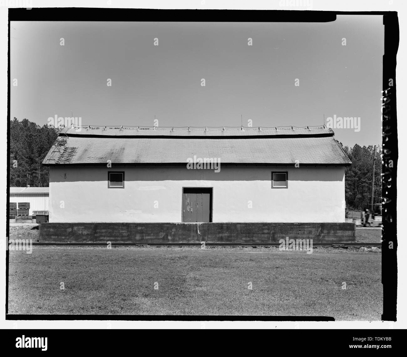 Oblique view of rear and south sides, view towards the north without ...