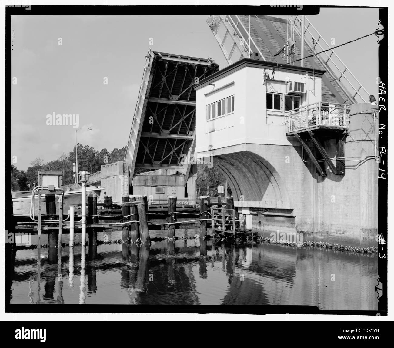 Oblique view of south side of eastern end of raised drawbridge and ...