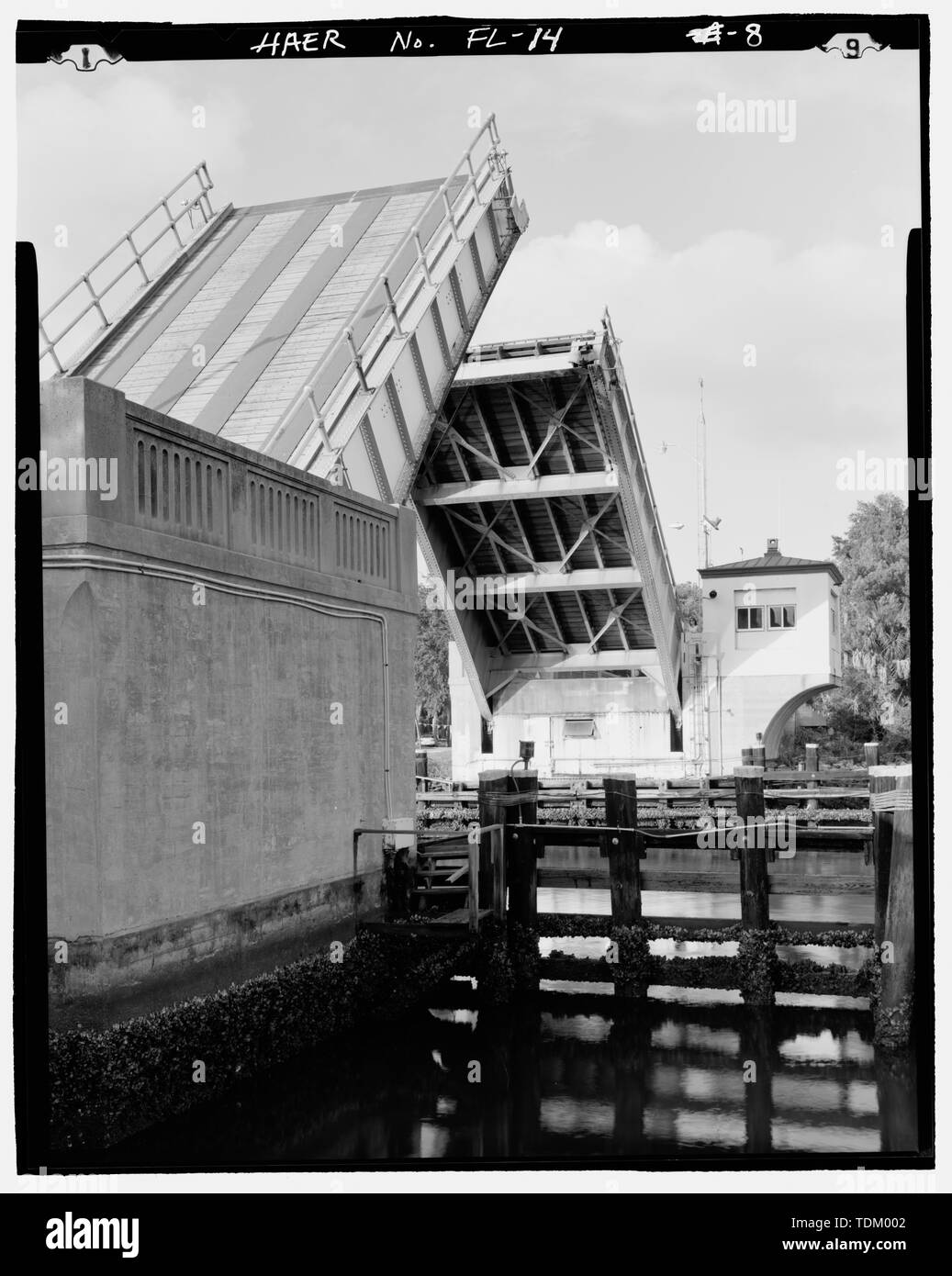 Oblique view of south side of western end of raised drawbridge and ...