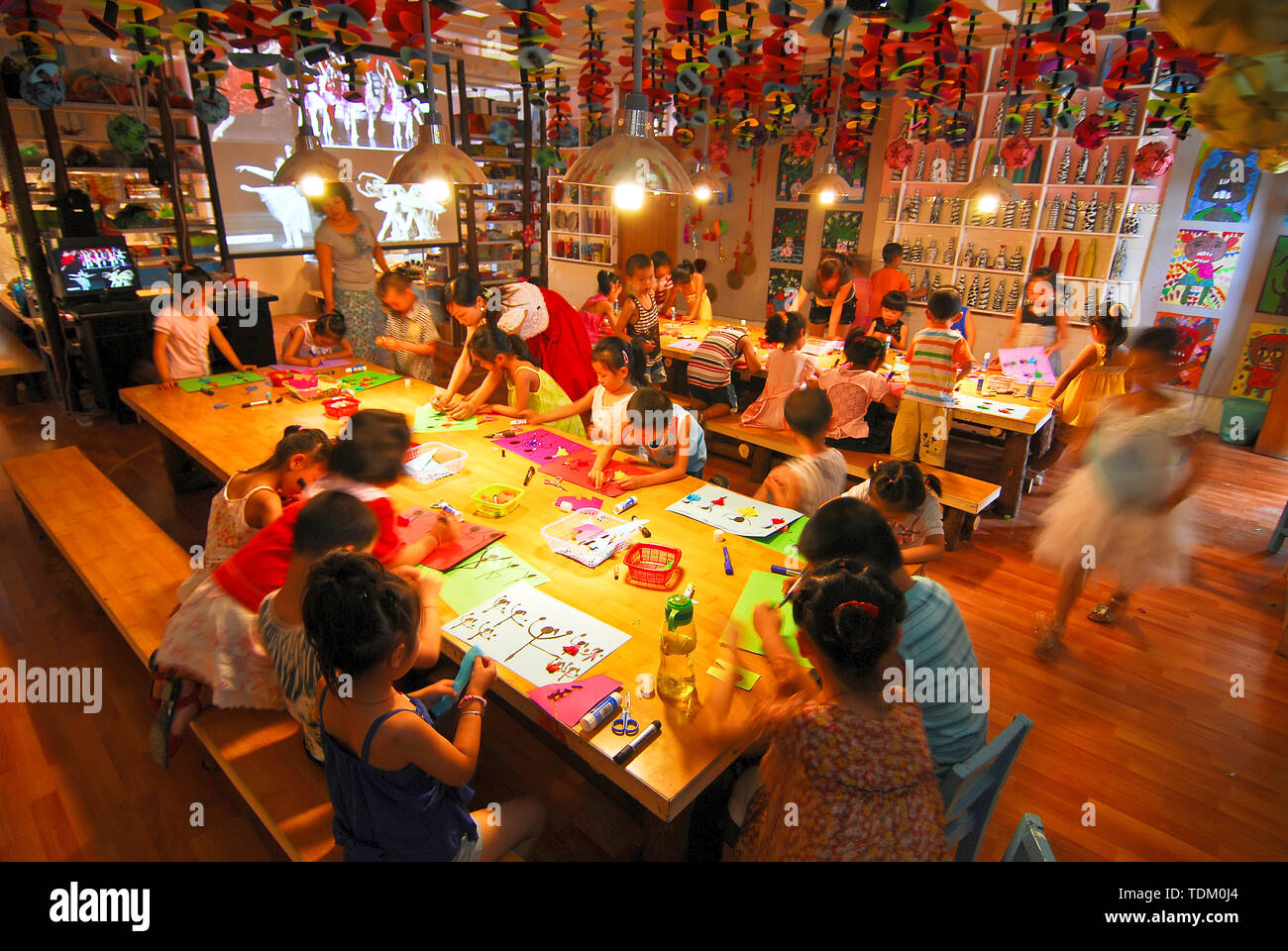 Kindergarten children, under the guidance of their teachers, do ...