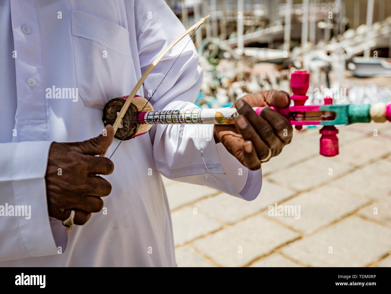 Jordanian Vendor Demonstrates How to Play Native Three String ...