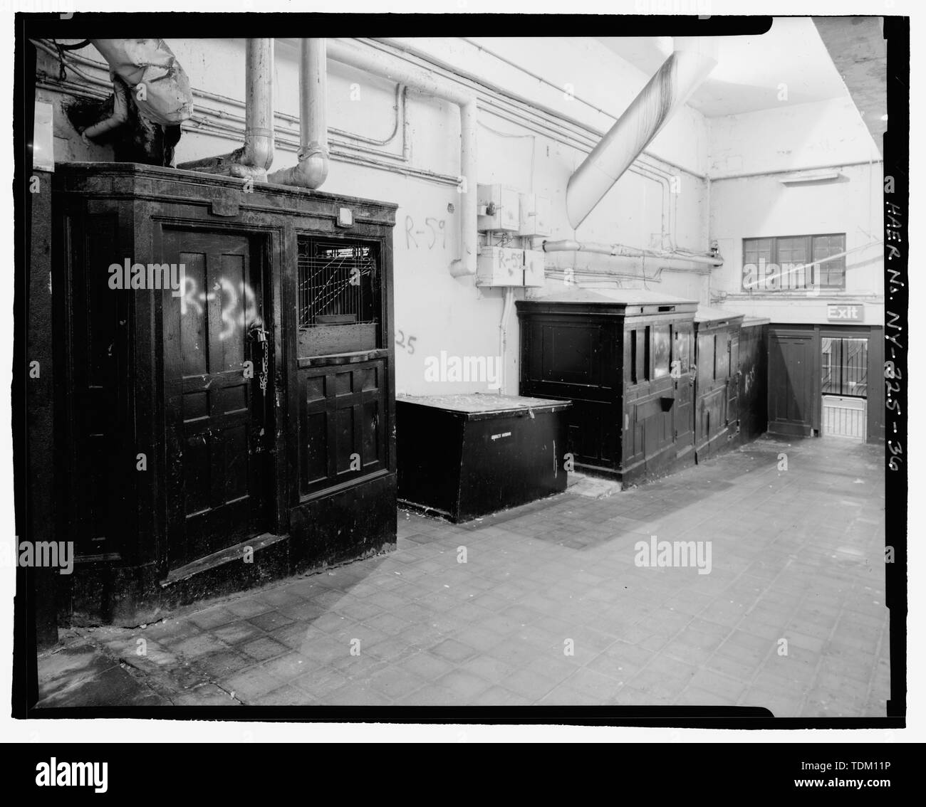 Original ticket booth and concession booths along east wall inside ...