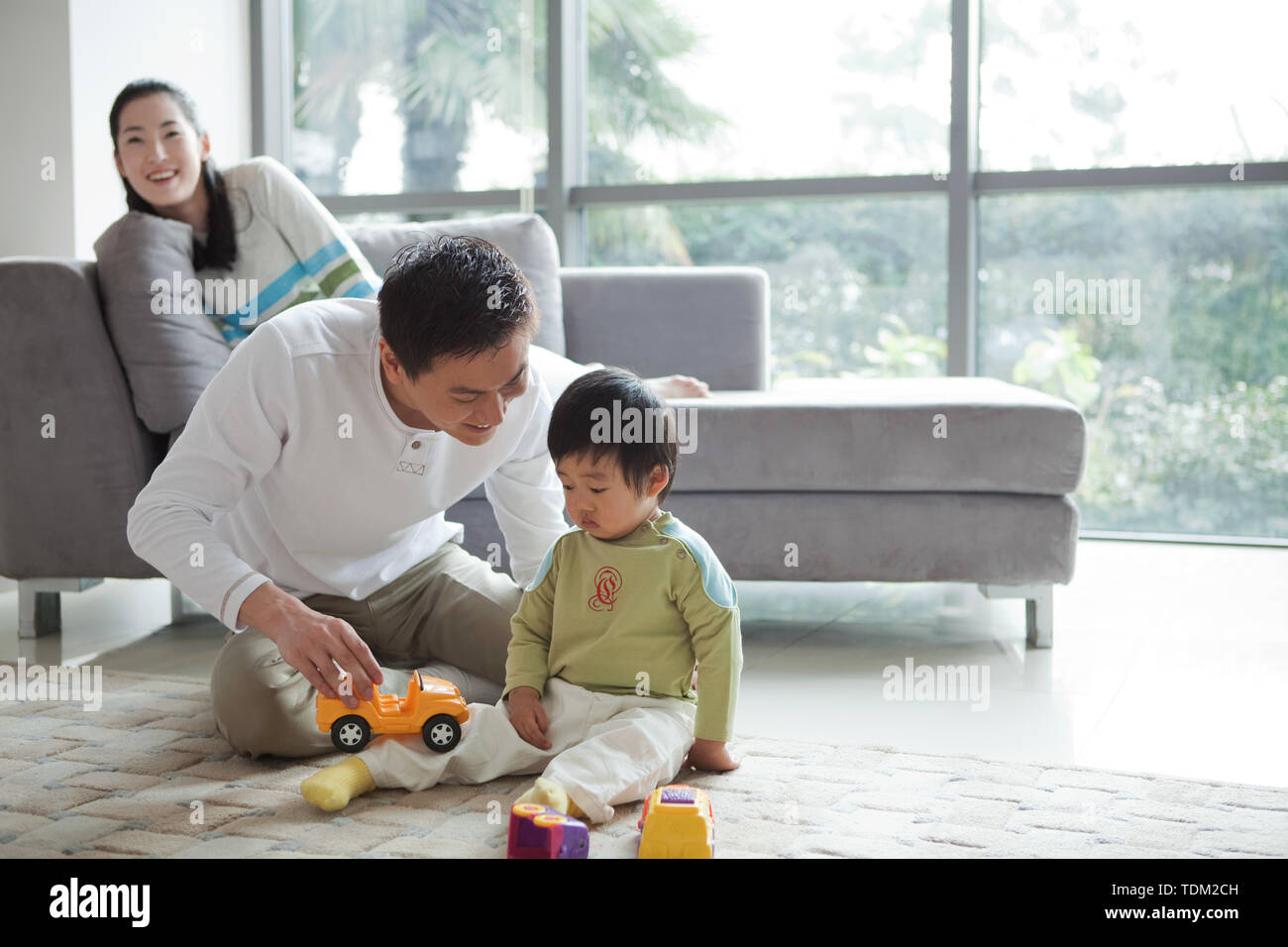Parents and children play games Stock Photo - Alamy
