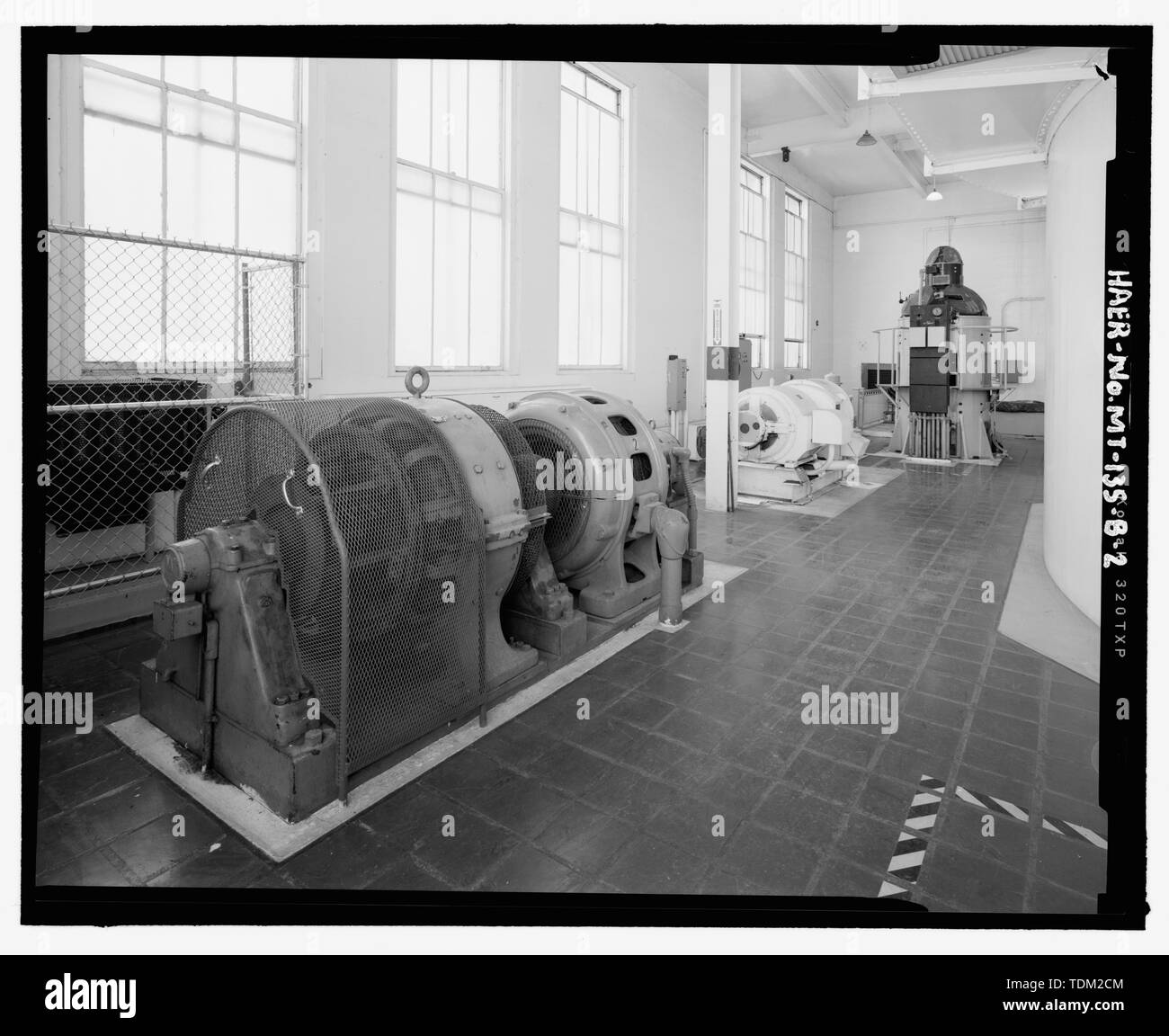 Overview of Powerhouse interior showing exciter units on generating ...