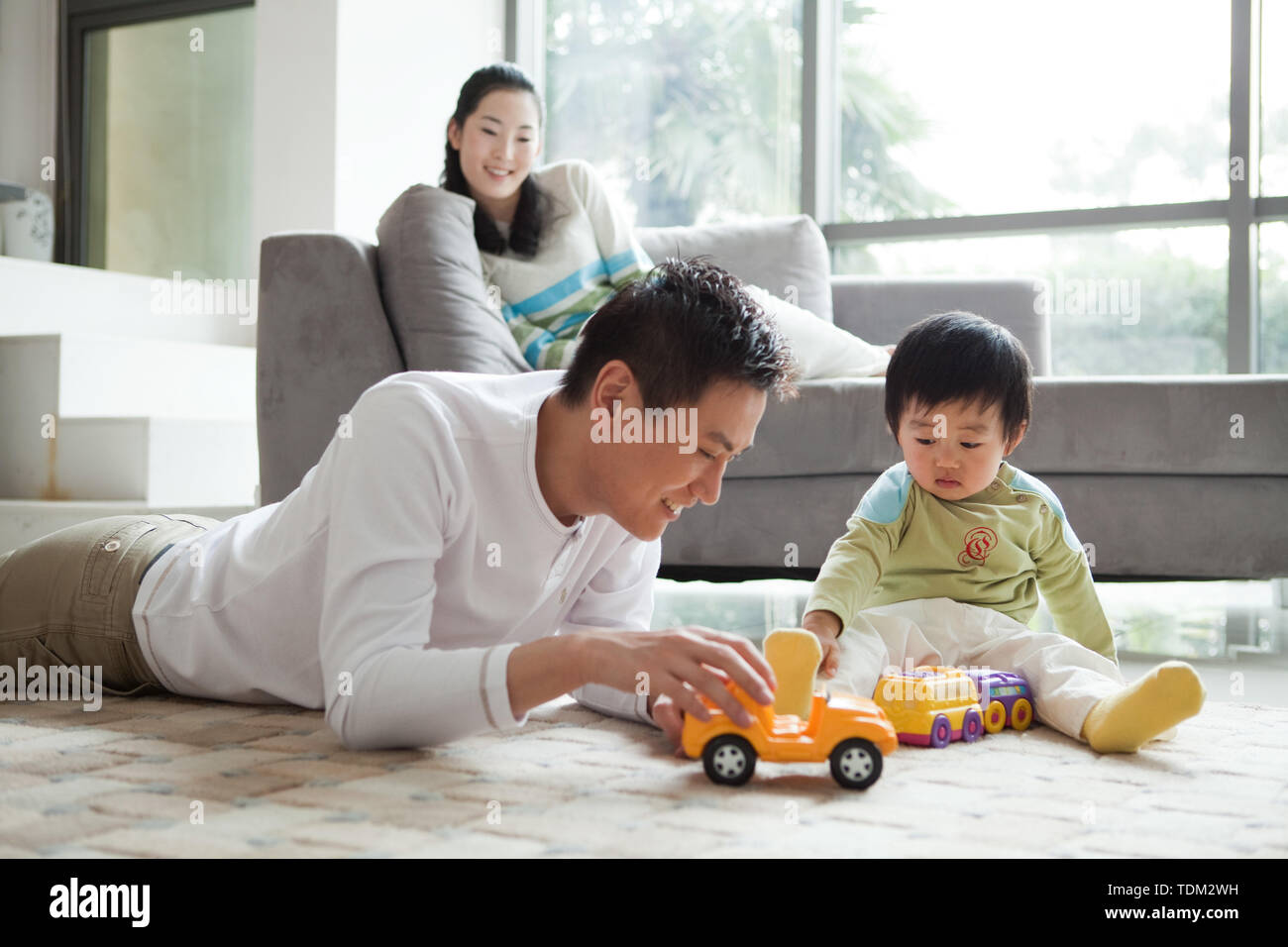 Parents and children play games Stock Photo - Alamy