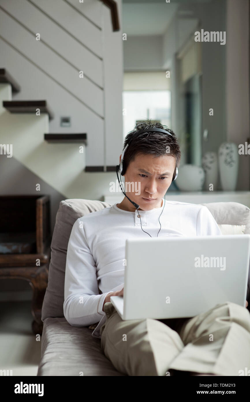 A man surfing the Internet Stock Photo - Alamy
