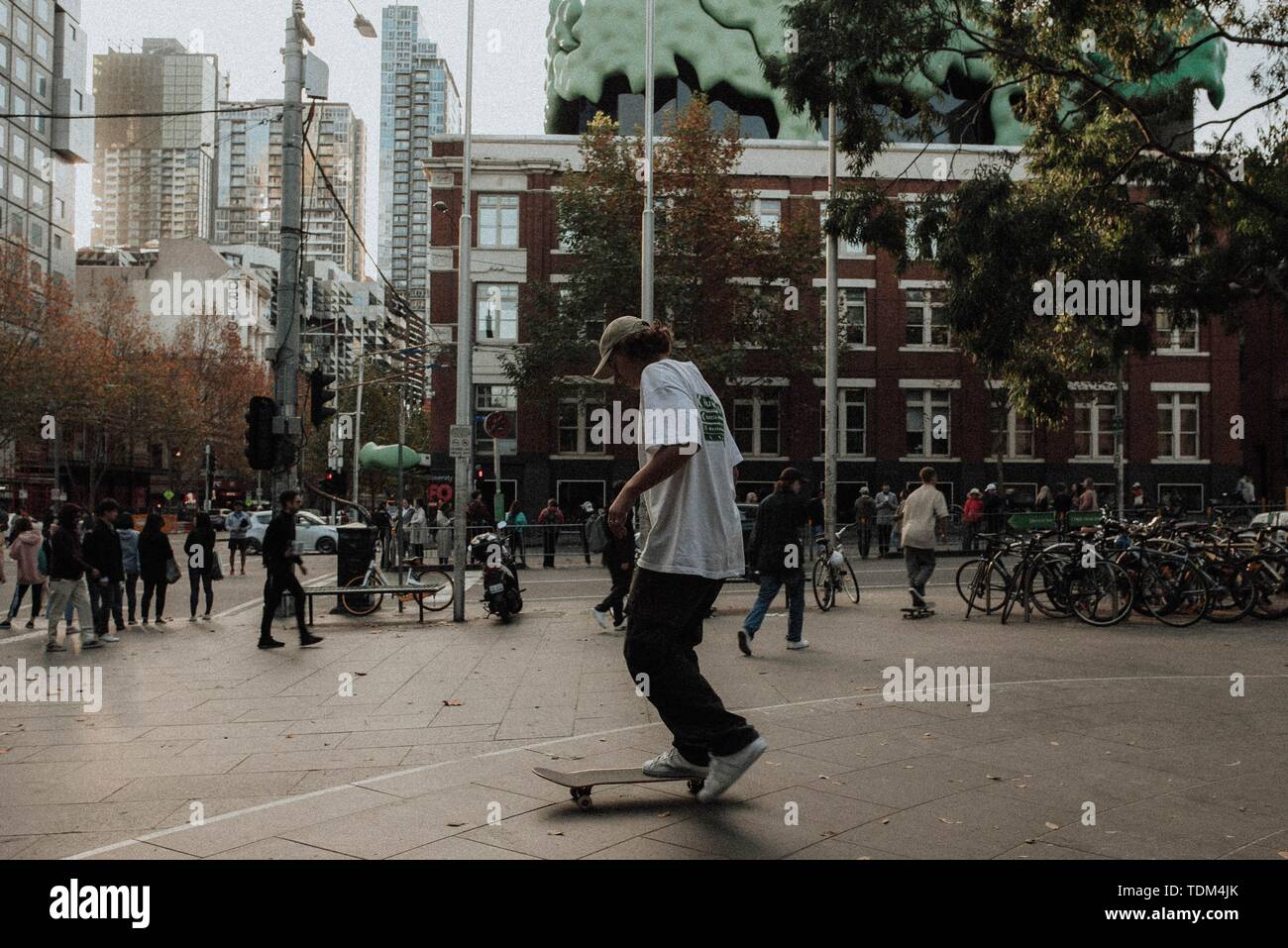 Skateboarder doing tricks at a skate park in a city Stock Photo - Alamy