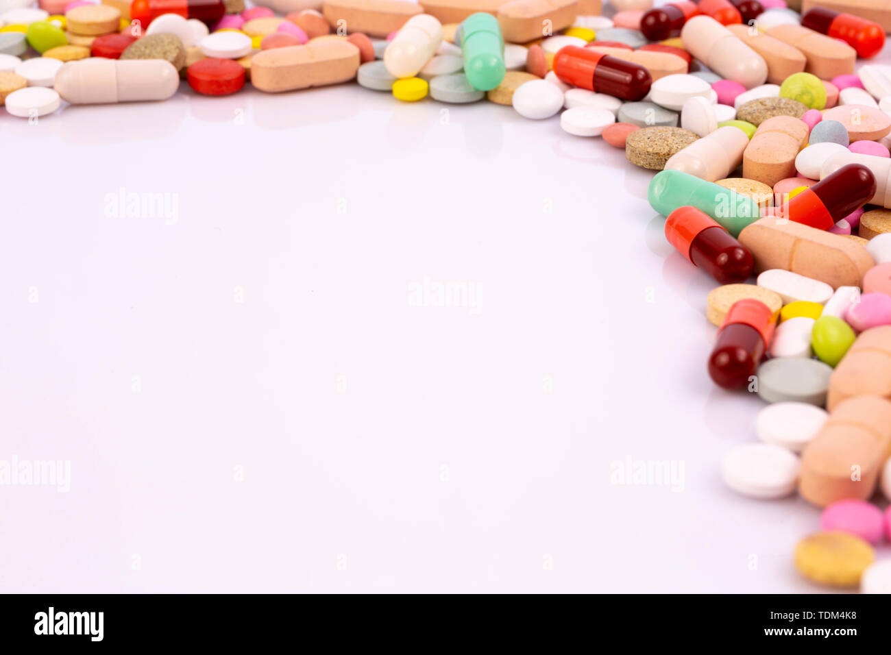 Different colorful pills and capsules. Global pharmaceutical industry ...