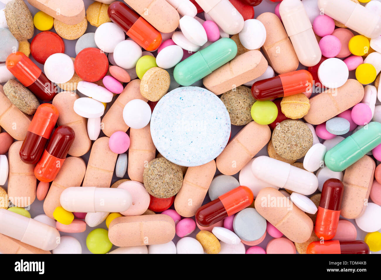 Different colorful pills and capsules. Global pharmaceutical industry ...
