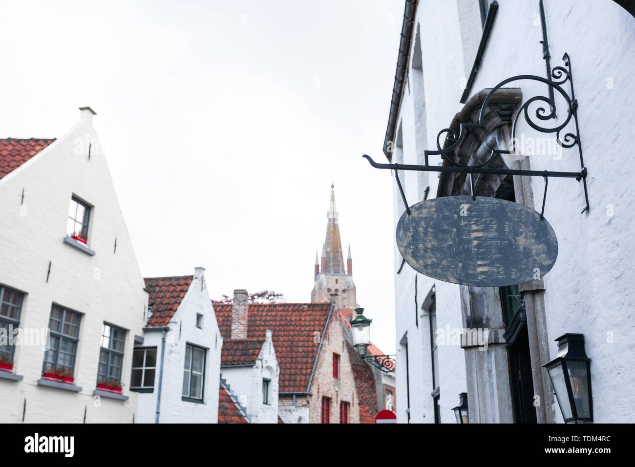 Beautiful old sign on the facade in the historical center of Bruges ...