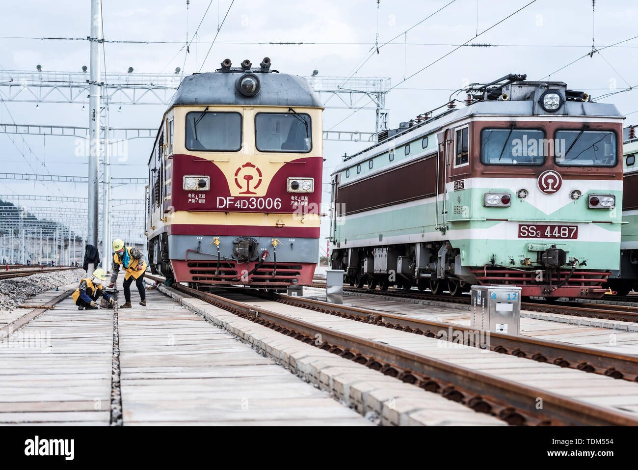 Railway workers maintain high-speed rail tracks in Kunming, southwest ...