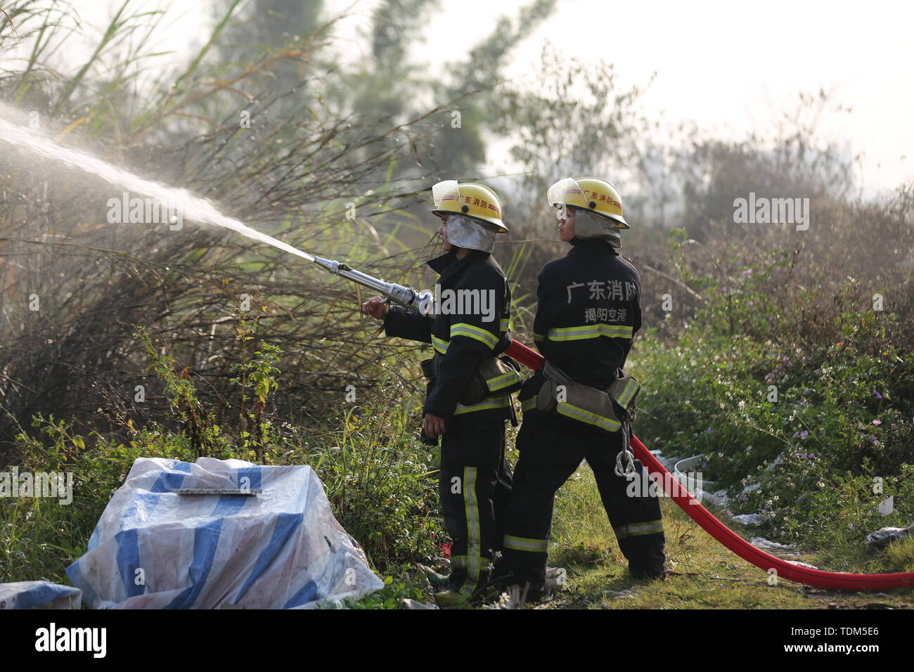 Firefighters fighting the fire Stock Photo - Alamy