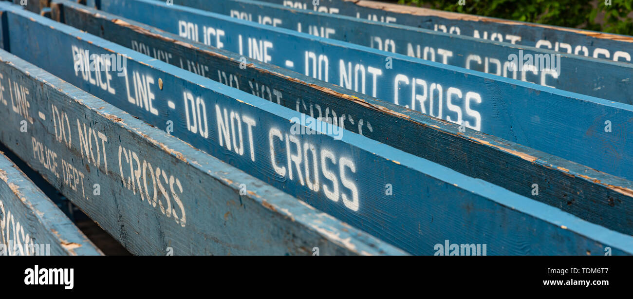 Police line do not cross background, NYPD. Warning blue barries, text ...