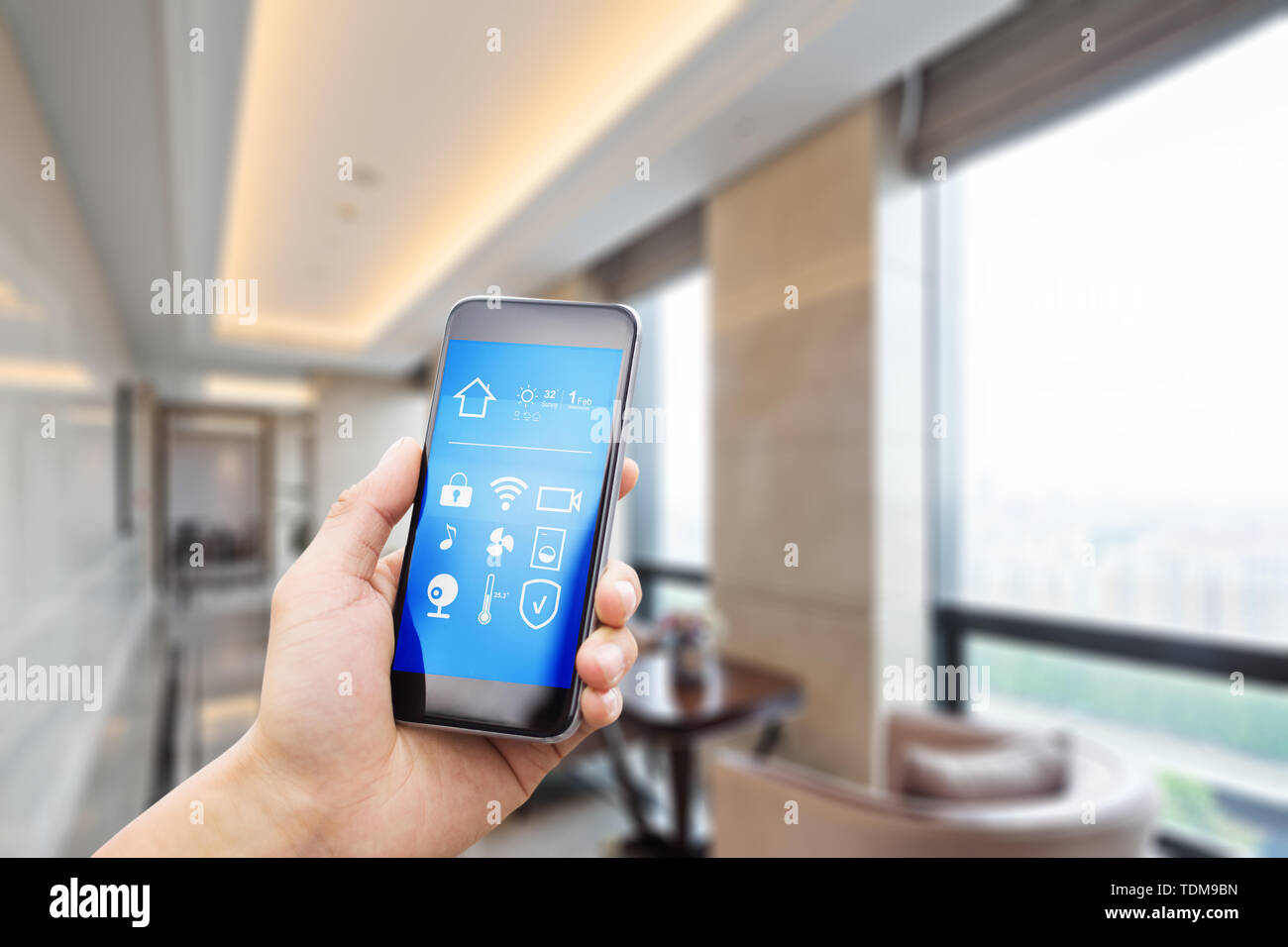 mobile phone with living room in smart home Stock Photo - Alamy