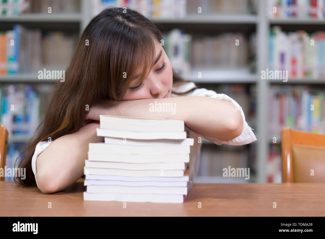 Beautiful asian femle student take nap in library during studyin Stock ...
