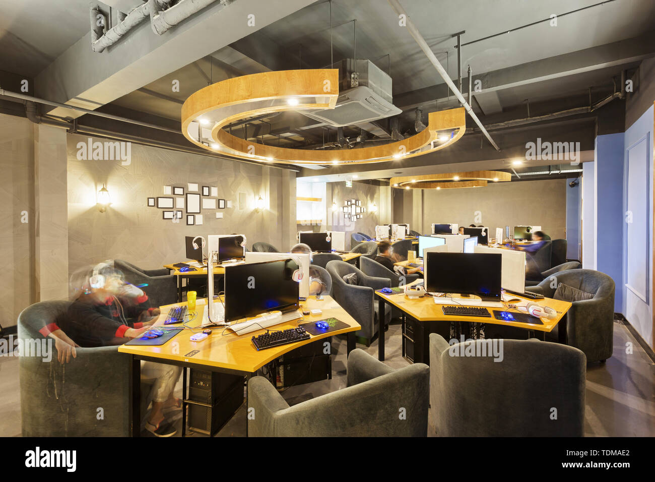 People playing games in Internet cafe Stock Photo - Alamy
