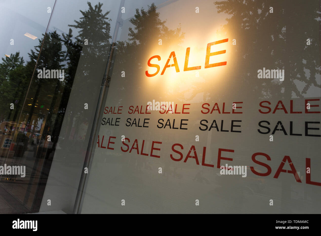 sale poster in the displaywindow of shop Stock Photo - Alamy