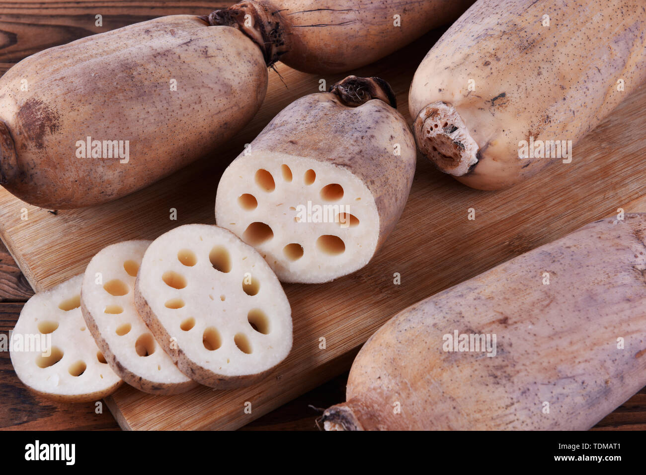 Fresh lotus root cut on the table, healthy and delicious ingredients ...