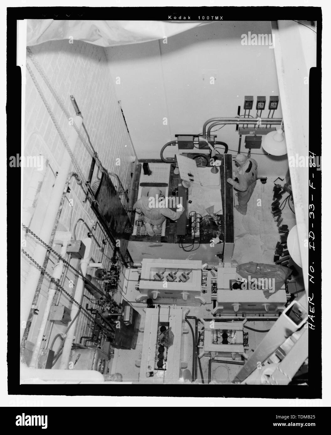 PBF Reactor Building (PER-620) basement. Workers wearing protective ...
