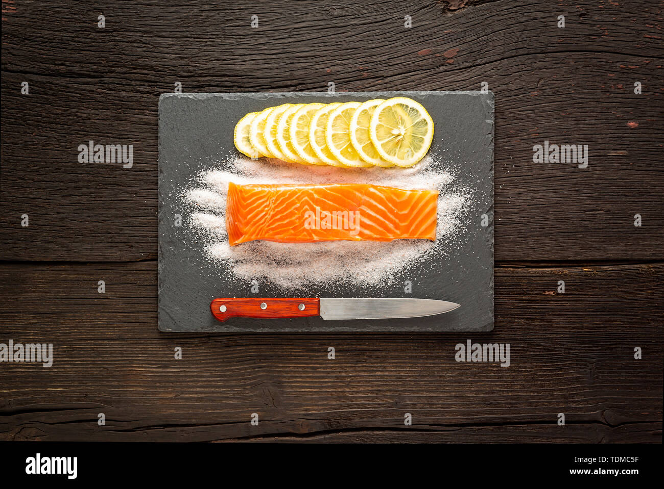 Piece of salted salmon on a stone board, top view. Concept: food Stock ...