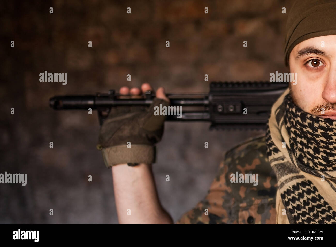 Portrait of serious middle eastern man with AK-47 Stock Photo - Alamy