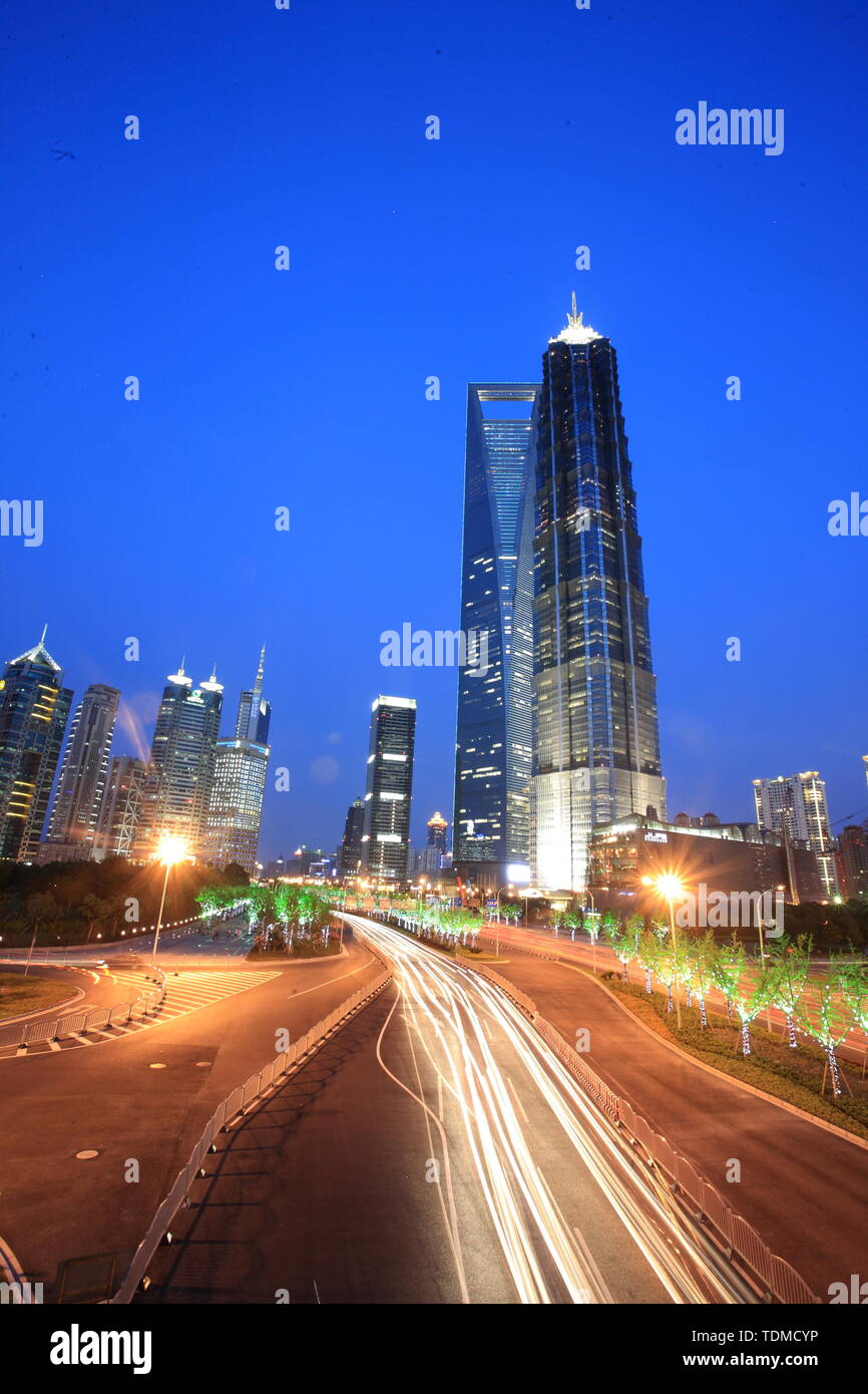 the light trails on the modern building background in shanghai c Stock ...