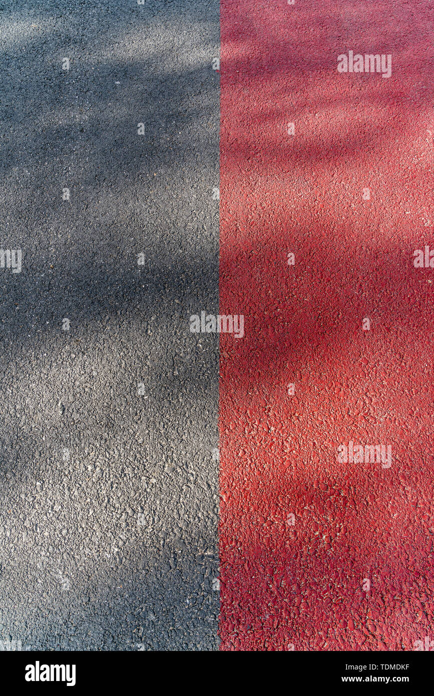 Red and black pavement material Stock Photo - Alamy