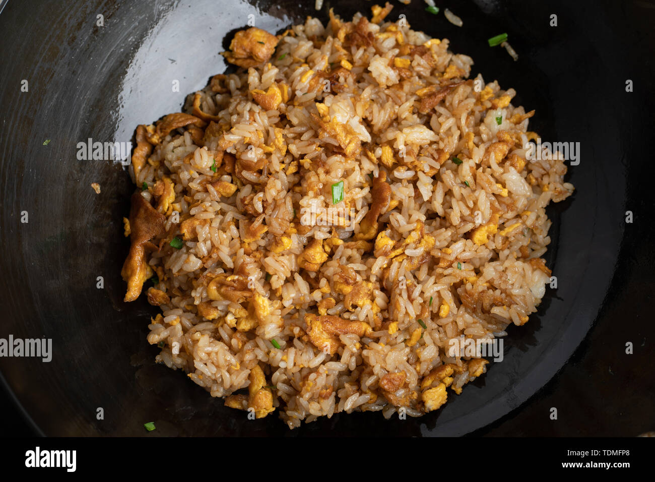 Egg fried rice in an iron pan Stock Photo - Alamy