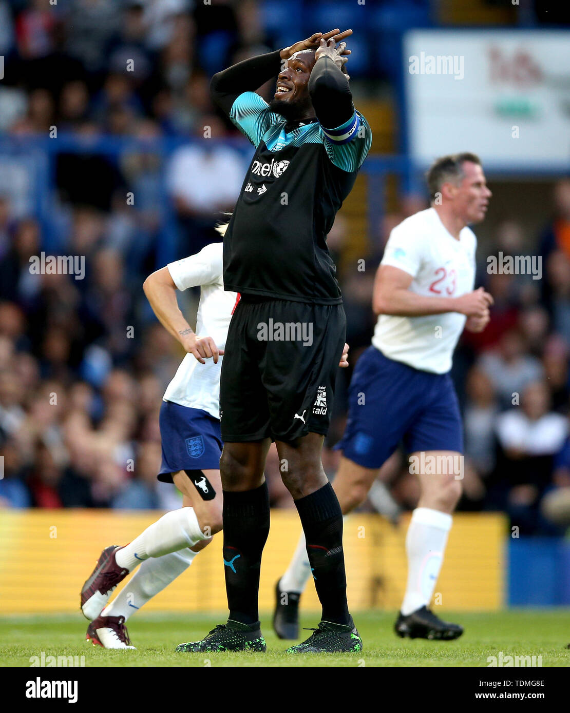 World Eleven's Usain Bolt reacts on the pitch during the Soccer Aid ...