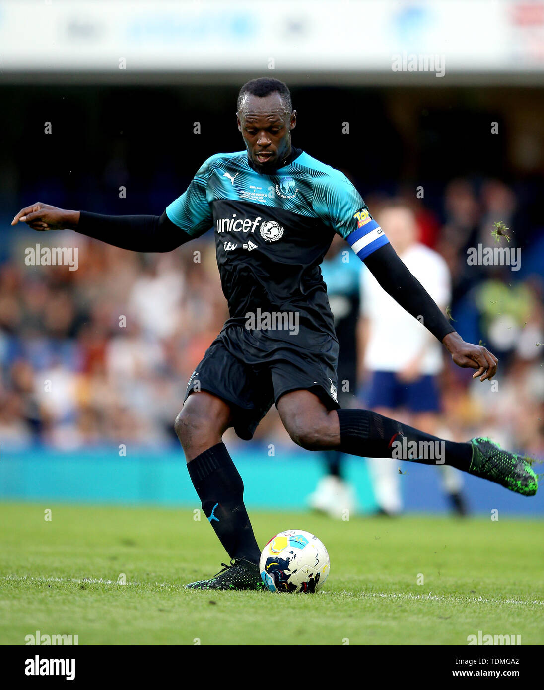 World Eleven's Usain Bolt in action during the Soccer Aid match at ...