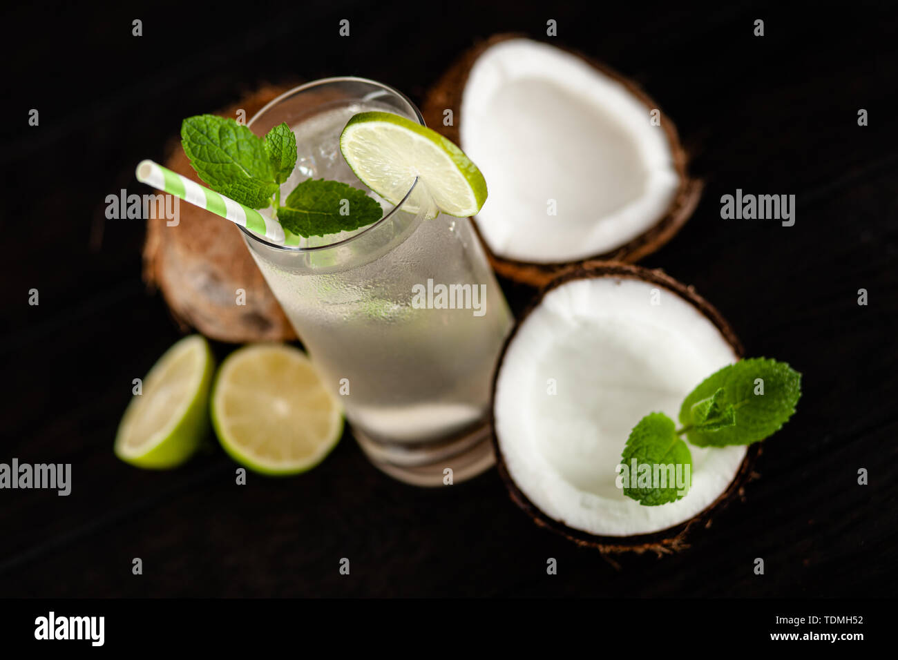 Coconut water drink on dark background Stock Photo - Alamy