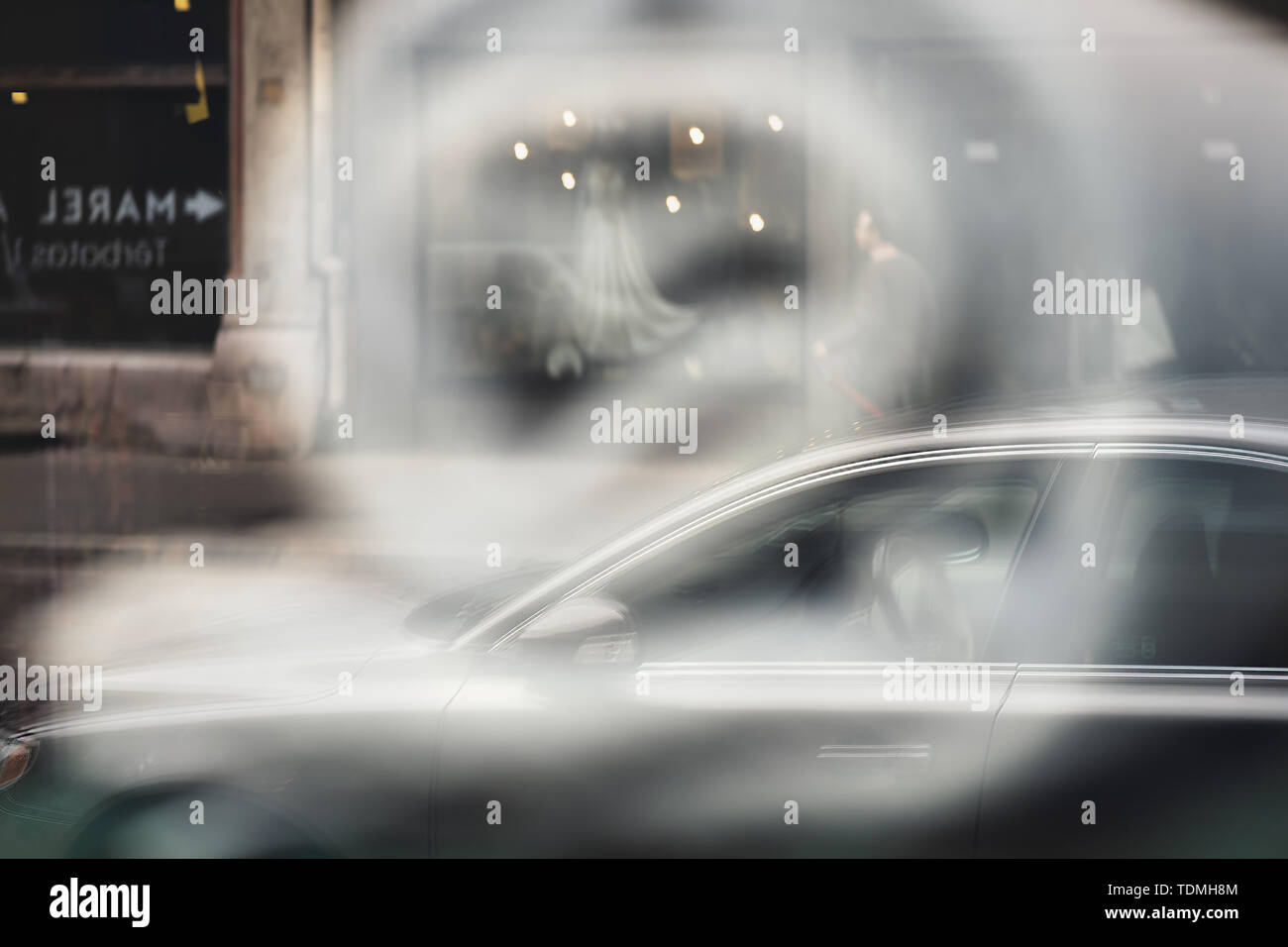 Reflection of city life in a shop window Stock Photo - Alamy