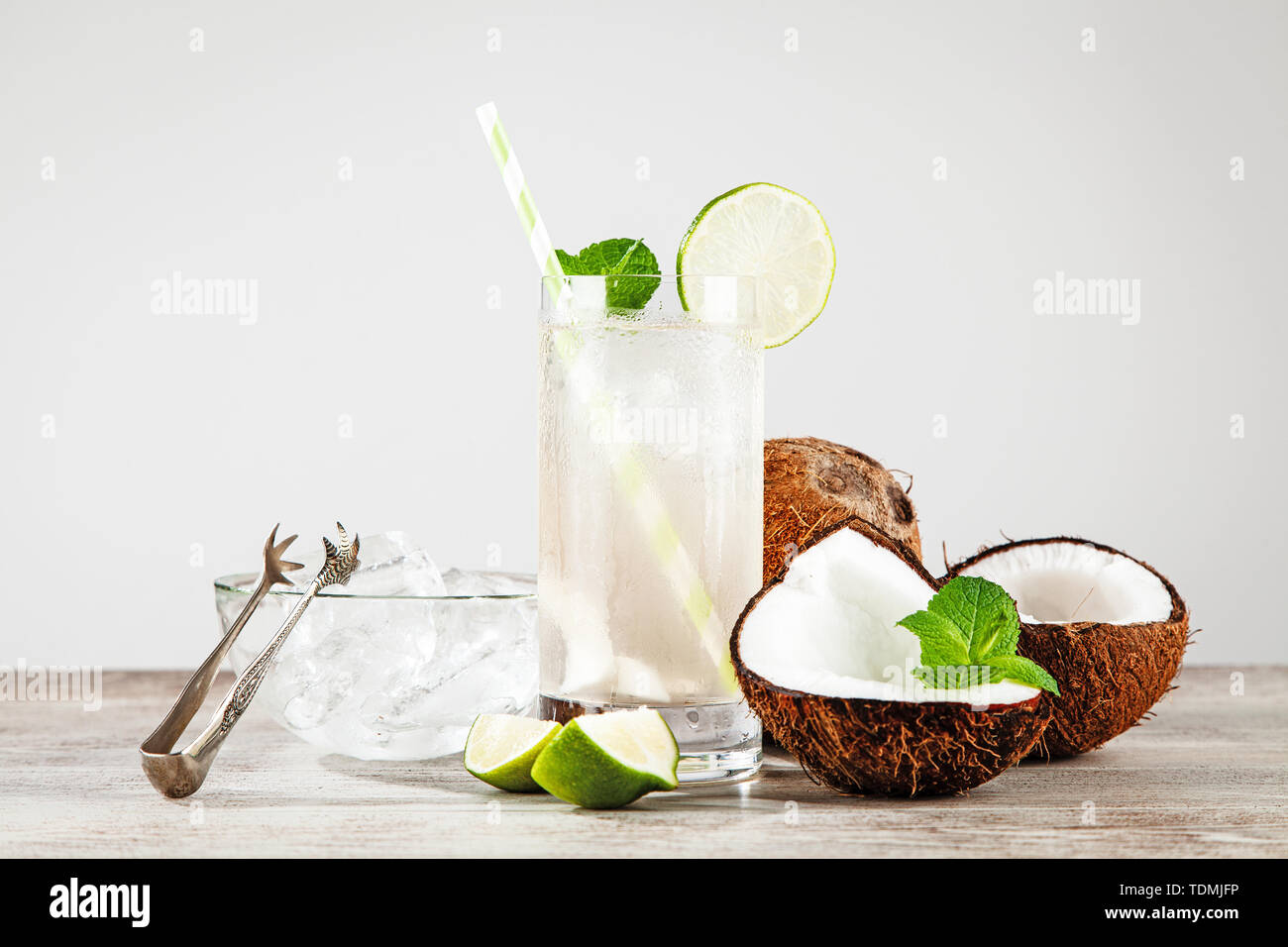 Coconut water drink on wooden background Stock Photo - Alamy