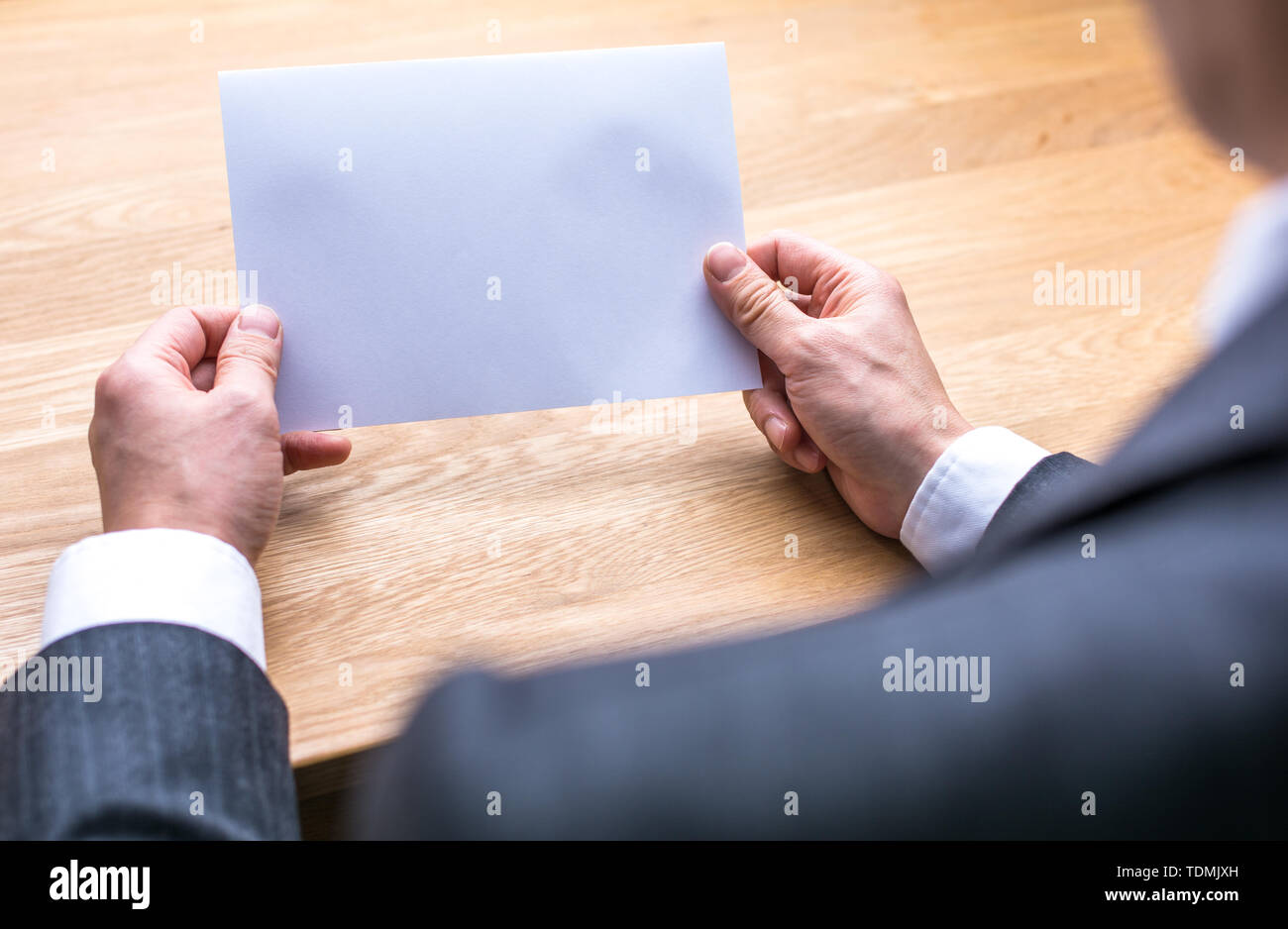 hand of businessman and blank white paper Stock Photo - Alamy