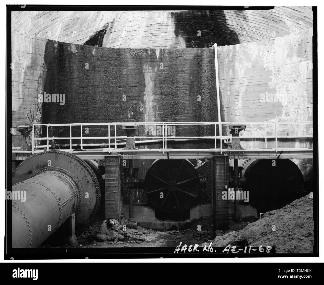 Penstock at left with operating wheel mechanism. The two outlets ...