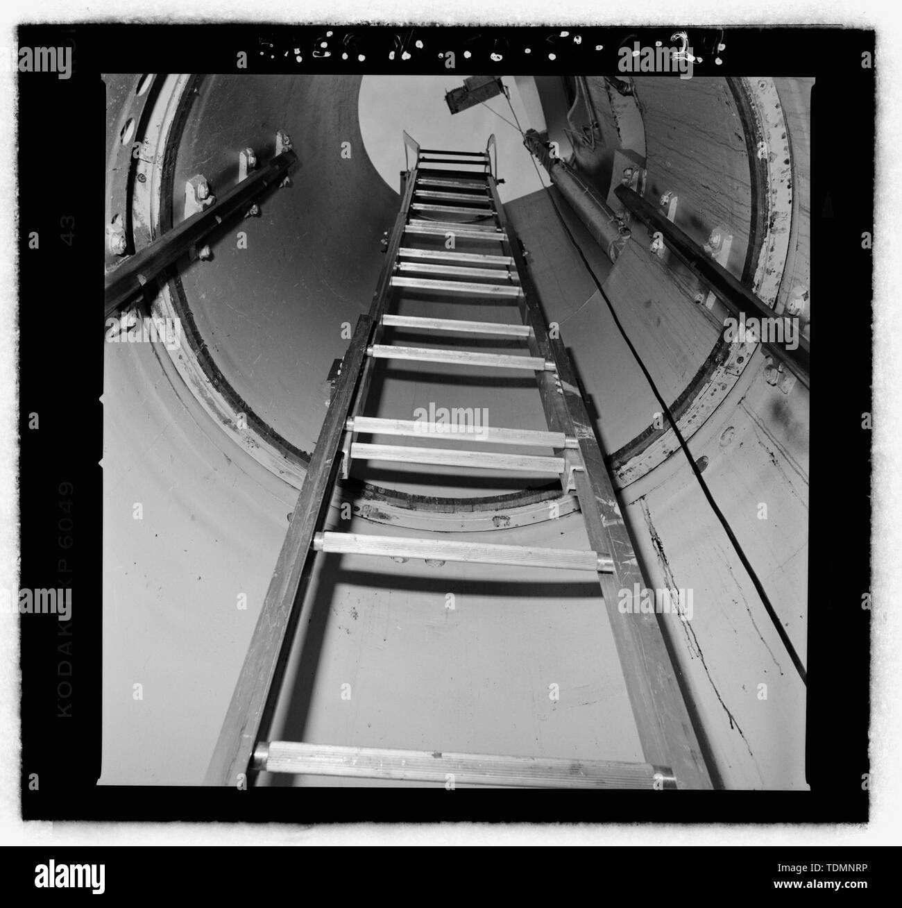 Personnel access ladder, from upper level of launch facility ...
