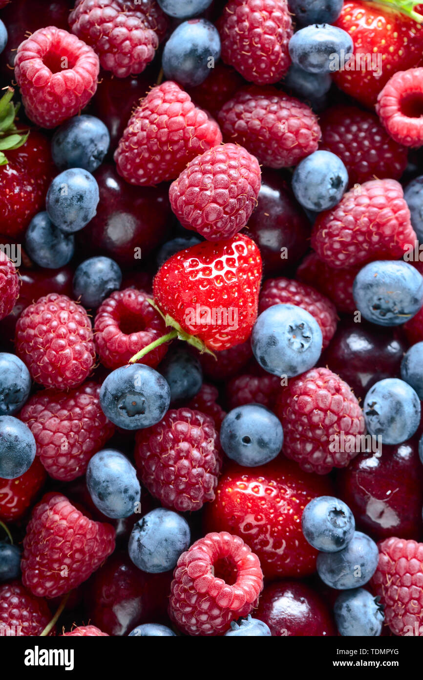 Berries closeup assorted mix of strawberry, blueberry, raspberry and ...