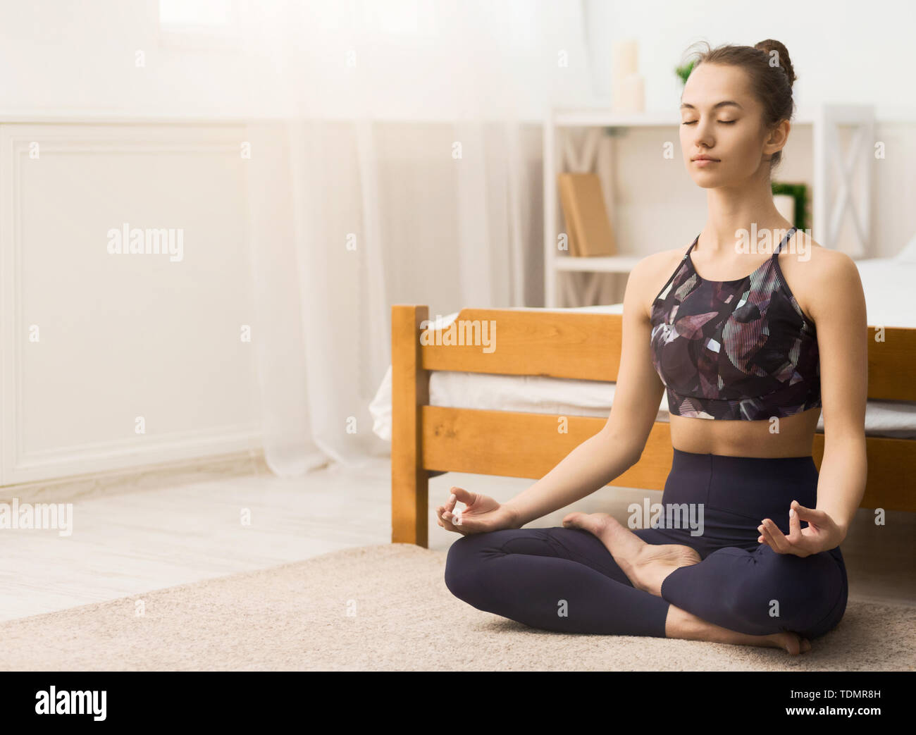 Girl sitting in yoga position hi-res stock photography and images - Alamy