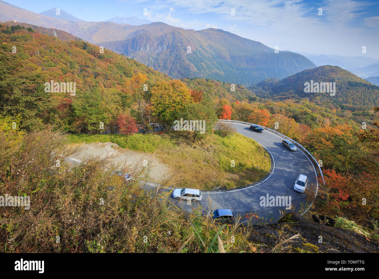 Road along the mountain with leaves turning color - Nikko, Japan Stock ...