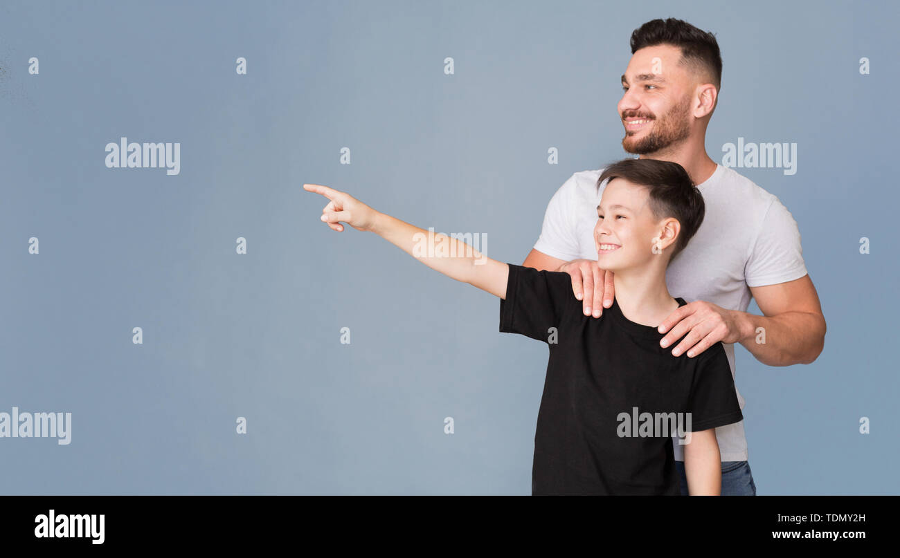 Cheerful boy showing something for his dad, pointing with finger Stock ...