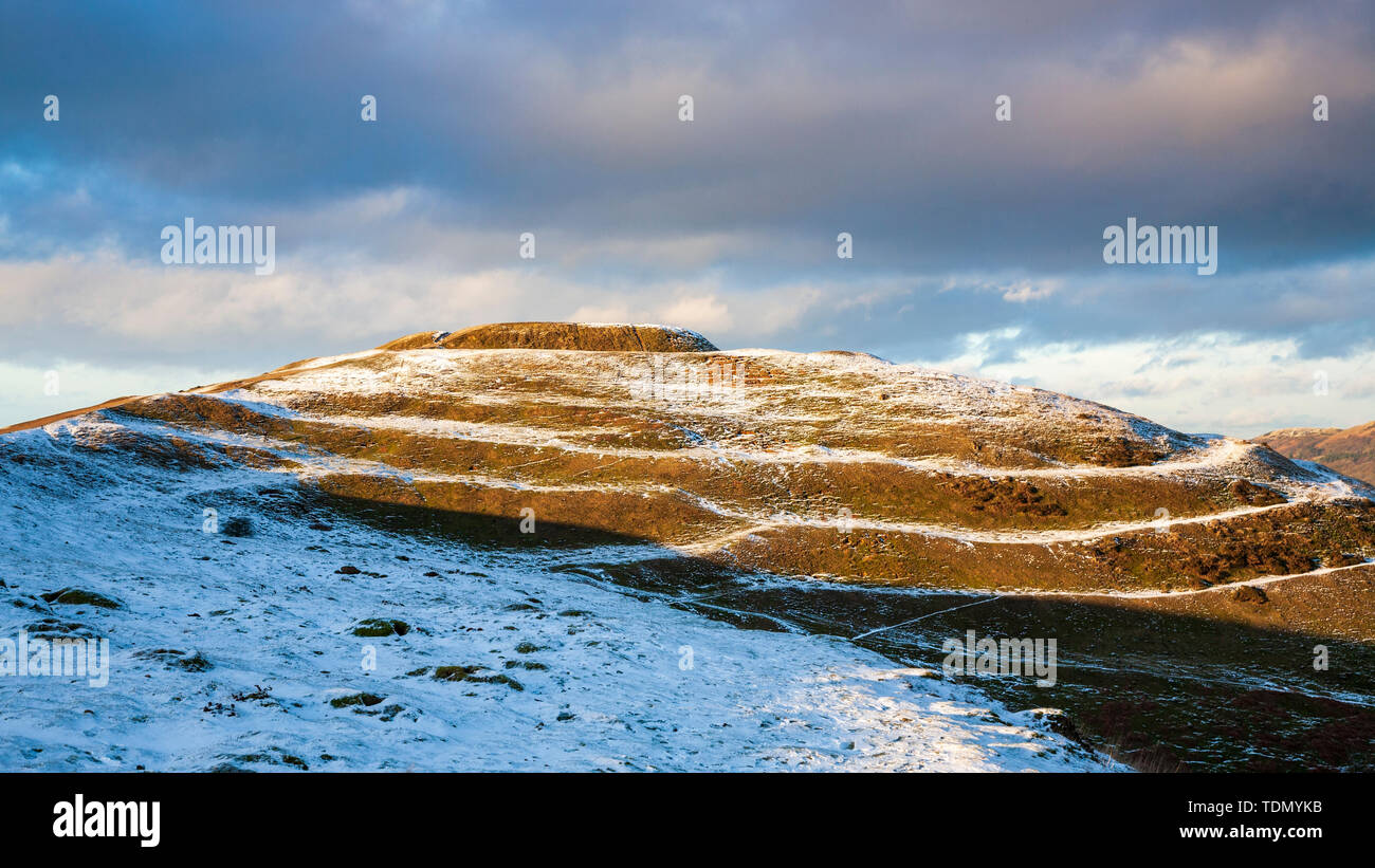 The snow filled defensive ditches of British Camp Iron Age Fort in the ...